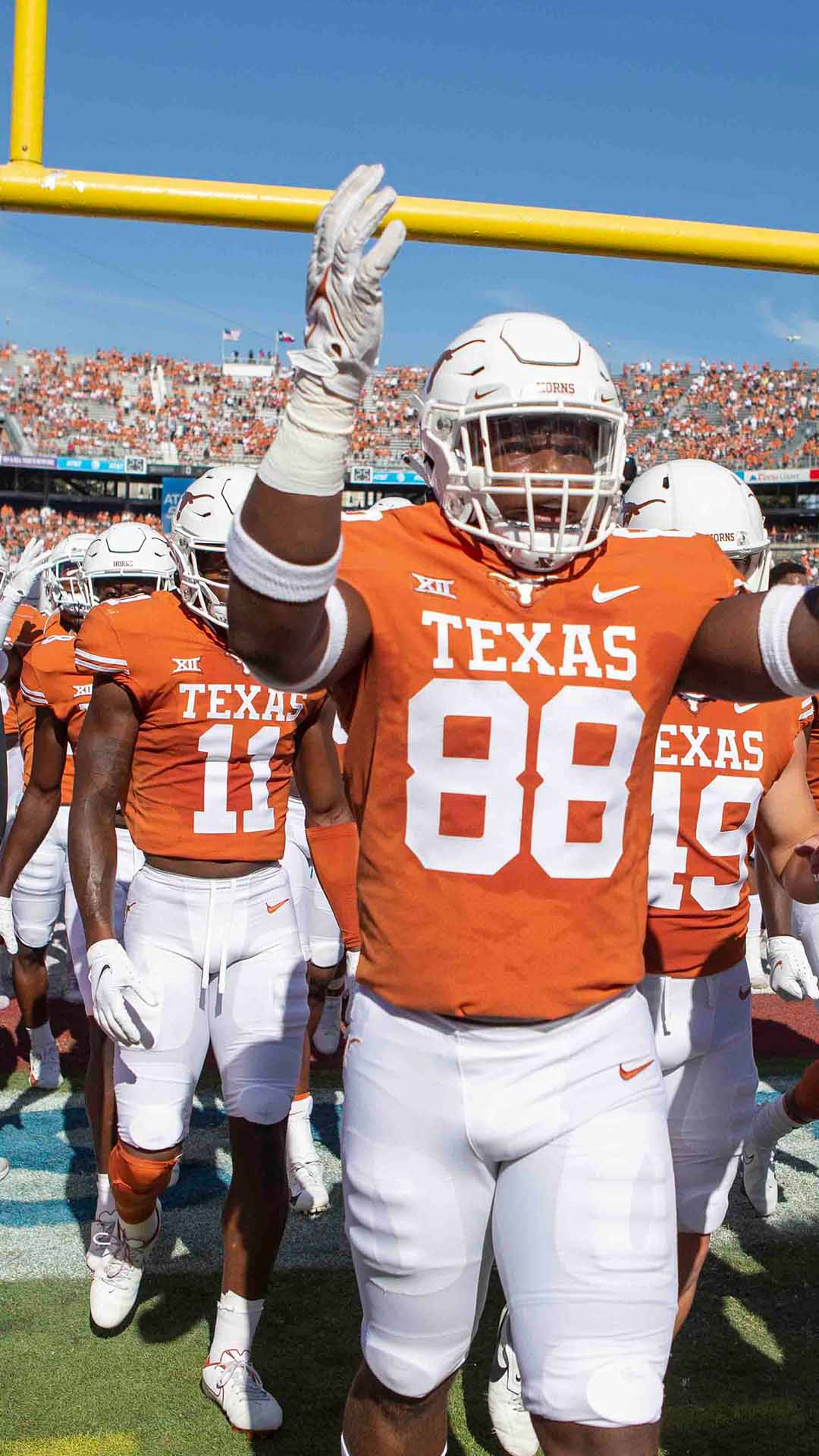 Texas Longhorns Football players coming on field - Horns Illustrated