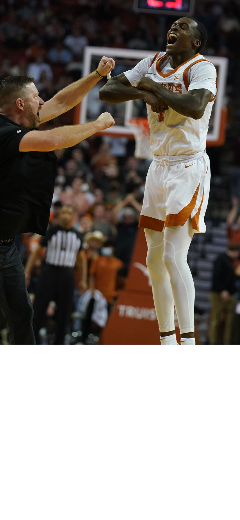 Coach Beard Celebrates with Andrew Jones - Horns Illustrated